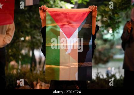 Ankara, Turkey. 07th Oct, 2023. A woman carries a Palestinian flag ...