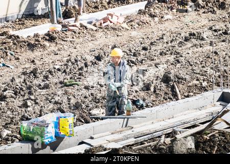 Group of construction workers taking a break Stock Photo - Alamy