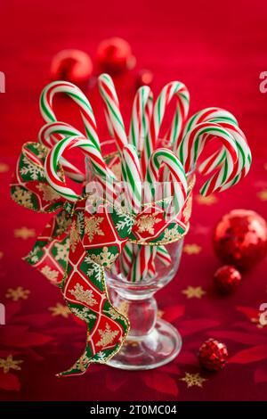 Beautiful Christmas composition with candy cane, gift, cones and cookie ...