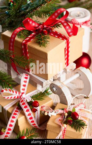 Christmas decoration. Gift boxes and fir tree branches on green ...