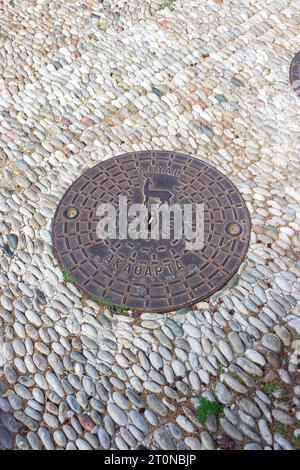Round manhole cover, a removable plate covering an opening in the ...