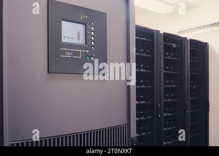 In the server room, the UPS battery is connected to an emergency power ...