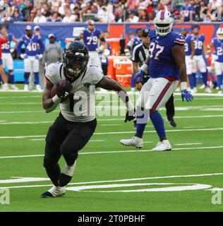 Jacksonville Jaguars running back Travis Etienne Jr. (1) scores while ...