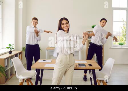 Group Of Fit People Doing Stretching Exercise On White Background Stock ...