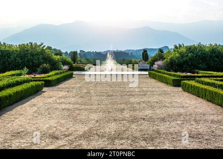 A fountain spewing water into the air. Photo of a beautiful fountain in ...