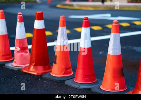 A number of red traffic cones, limiting the passage Stock Photo - Alamy