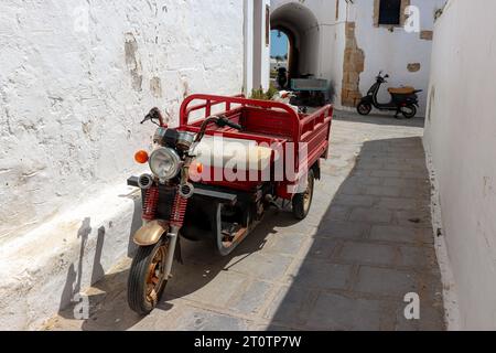 Red Tuk Tuk Rickshaw, a three wheel passenger transportation cart ...