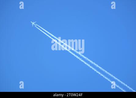 Large two engine passenger supersonic aircraft flying from right to ...