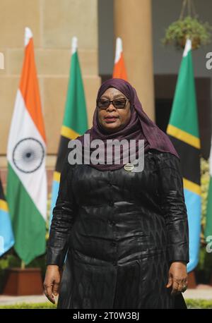 Tanzanian President Samia Suluhu Hassan dance during a campaign rally ...