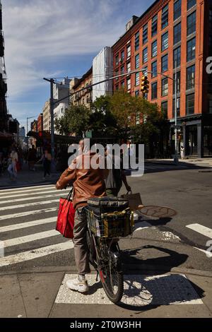 cyclist waiting at the crossroad Stock Photo - Alamy