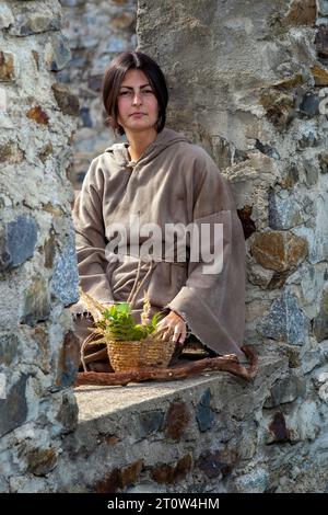 Poor medieval girl with herb bowl Stock Photo - Alamy