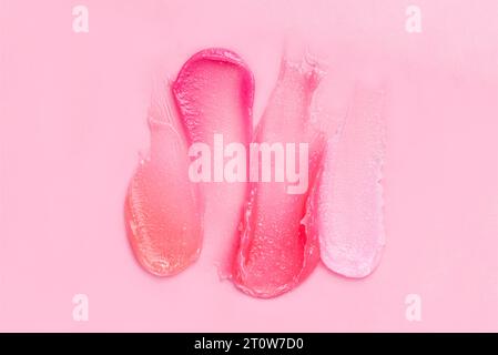 Set with make up cosmetics swatches ipstick, lip gloss on white ...