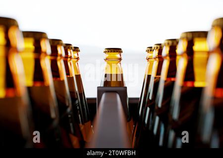 Glass bottles with liquid inside moving gradually in a factory pipeline ...