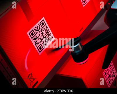 Warehouse drone scanning QR codes on the cardboard boxes in a metal ...