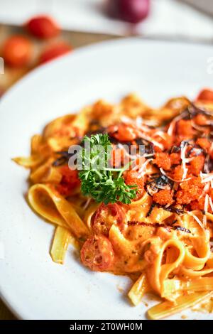 creamy sauce pasta with ebiko , selective focus Stock Photo - Alamy