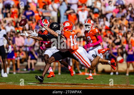 Clemson cornerback Jeadyn Lukus (10) breaks up a pass intended for Wake ...