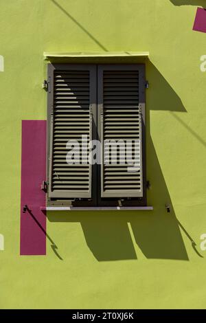Ghizzano, Italy-June 8, 2023; Detail of flaking off orange-brown wall ...