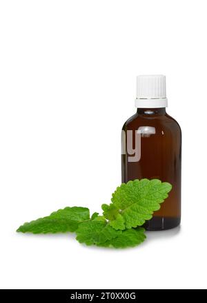 lemon essential oil in a medical bottle with a dropper on a white ...