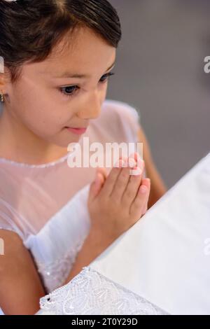First Communion Girl Praying, Toronto, Canada Stock Photo - Alamy