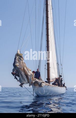 Crew members aboard on sailboat Tuiga, flagship of the Monaco Yacht ...