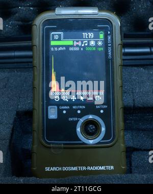 Personal military search dosimeter-radiometer for measuring levels of ...