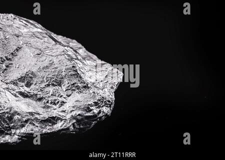 silver nugget native to Liberia isolated on black background Stock ...