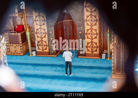 Child is praying inside mosque behind of imam place Stock Photo - Alamy