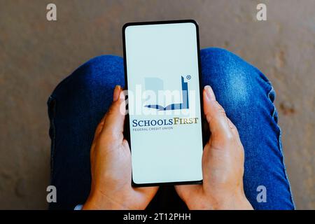 In this photo illustration, the SchoolsFirst Federal Credit Union logo ...