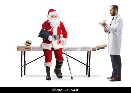Sad santa claus with injured leg and arm sitting on a mat table ...