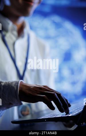 Developer working with artificial intelligence computerized model simulating human brain. Worker ...