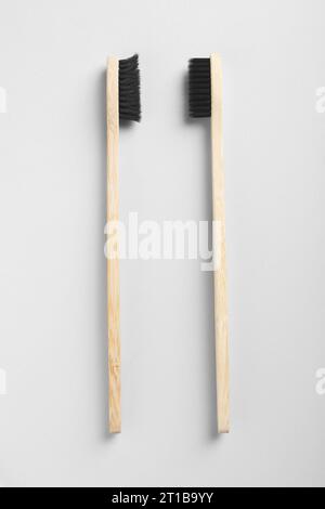 Old and new toothbrushes on old wooden background Stock Photo - Alamy
