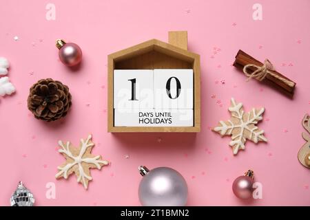Calendar with text 10 DAYS UNTIL HOLIDAYS and Christmas decor on white ...