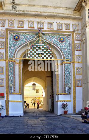 Decorative gate with mural paintings at Udaipur City Palace state ...