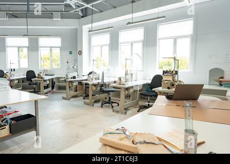 Interior of a sewing warehouse of furniture factory with equipment and ...
