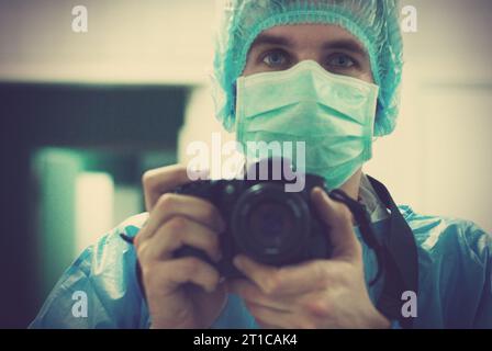 doctor photographing the medical procedures during surgery Stock Photo ...