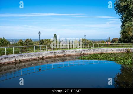 Reflecting water and fence at the Muur or wall, a step hill at ...