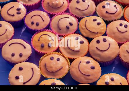 Smiley faces. smile cakes on table. The concept teamwork, friends ...