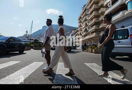 Pedestrians walk through the Nouvelle Chicane on the Monaco Grand Prix ...