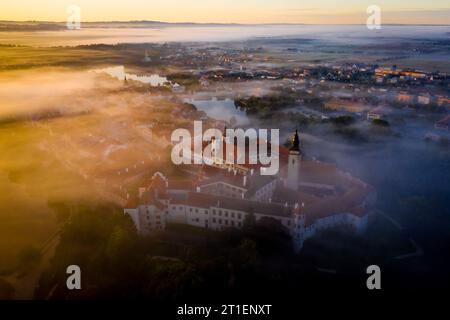 Aerial view of the historical centre of Telc on a foggy morning, with ...