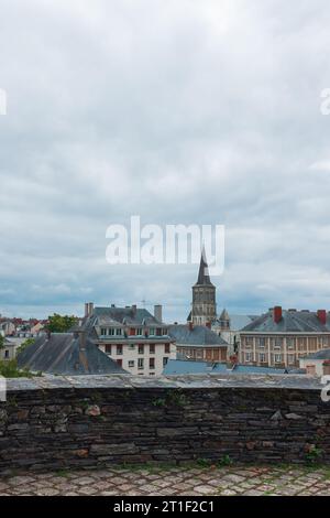 View of the church tower and slate roofs of the surrounding buildings ...