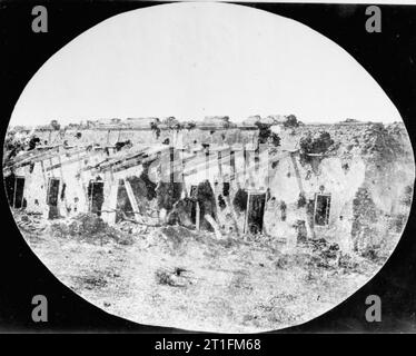 The Indian Mutiny 1857-1859 Aftermath of the Siege of Lucknow. The damaged gate of the Small ...