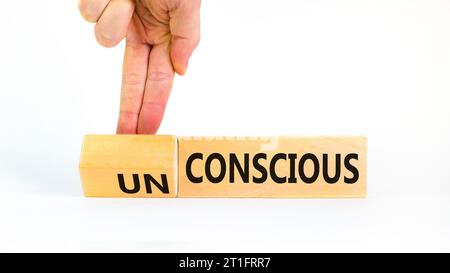 Conscious or unconscious symbol. Concept words Conscious Unconscious on wooden blocks. Beautiful ...