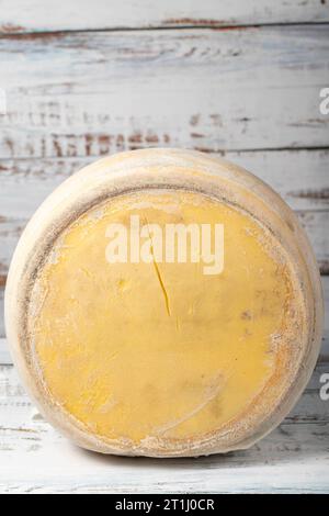 Wheel cheddar. Unsliced aged cheese isolated on white background Stock ...