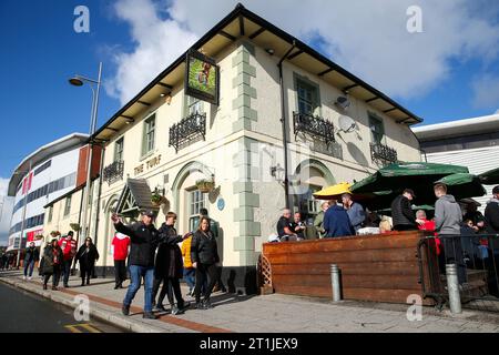Wrexham fans enjoy a drink at The Turf near the ground ahead of the ...
