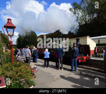 Tourists people watching train at Goathland Railway Station platform in ...