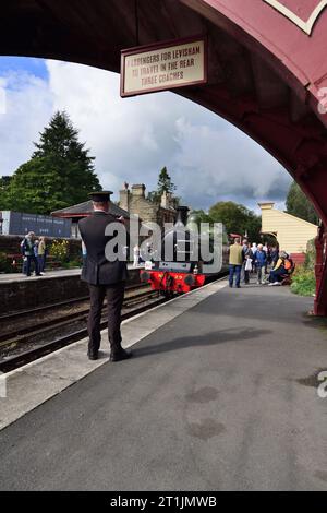 Tourists people watching train at Goathland Railway Station platform in ...
