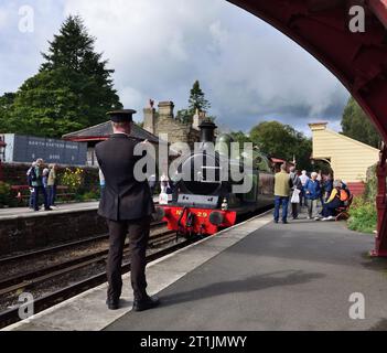 Tourists people watching train at Goathland Railway Station platform in ...