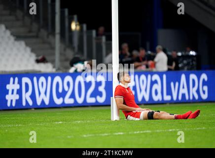Wales' Dafydd Jenkins sits on the pitch after the Rugby World Cup 2023 ...
