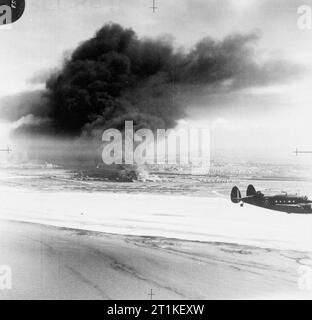 Oil tanks burn in Dunkirk, France, on June 5, 1940, as the RAF Coastal ...