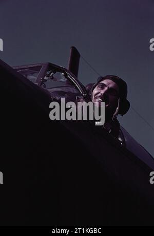 The Canadian pilot of a Vickers Wellington bomber looks out from his ...